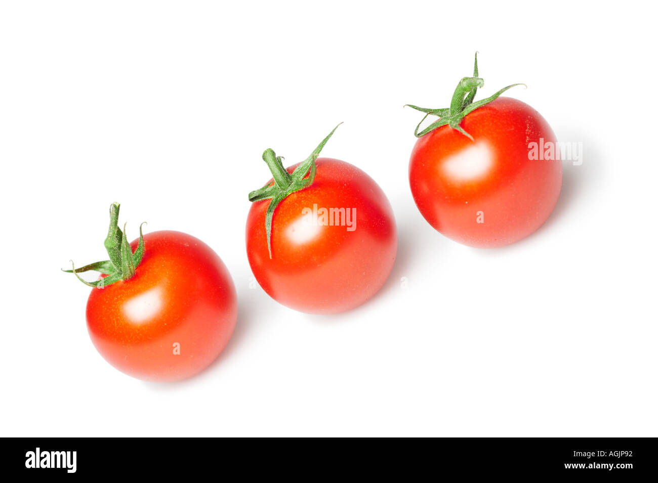 Three Cherry Tomato on White Background Stock Photo - Alamy