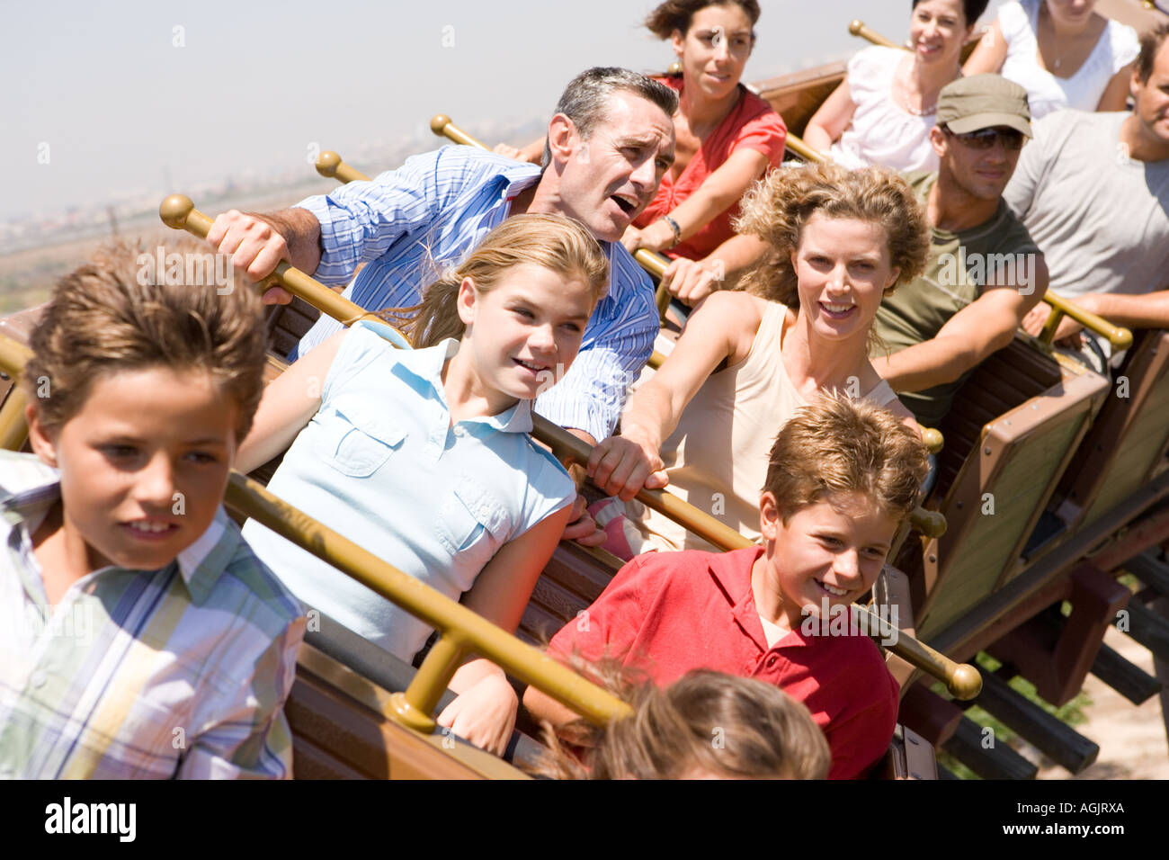 People riding a rollercoaster Stock Photo - Alamy