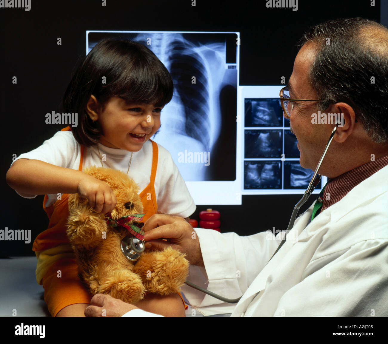 Doctor and 6 year old girl Stock Photo - Alamy
