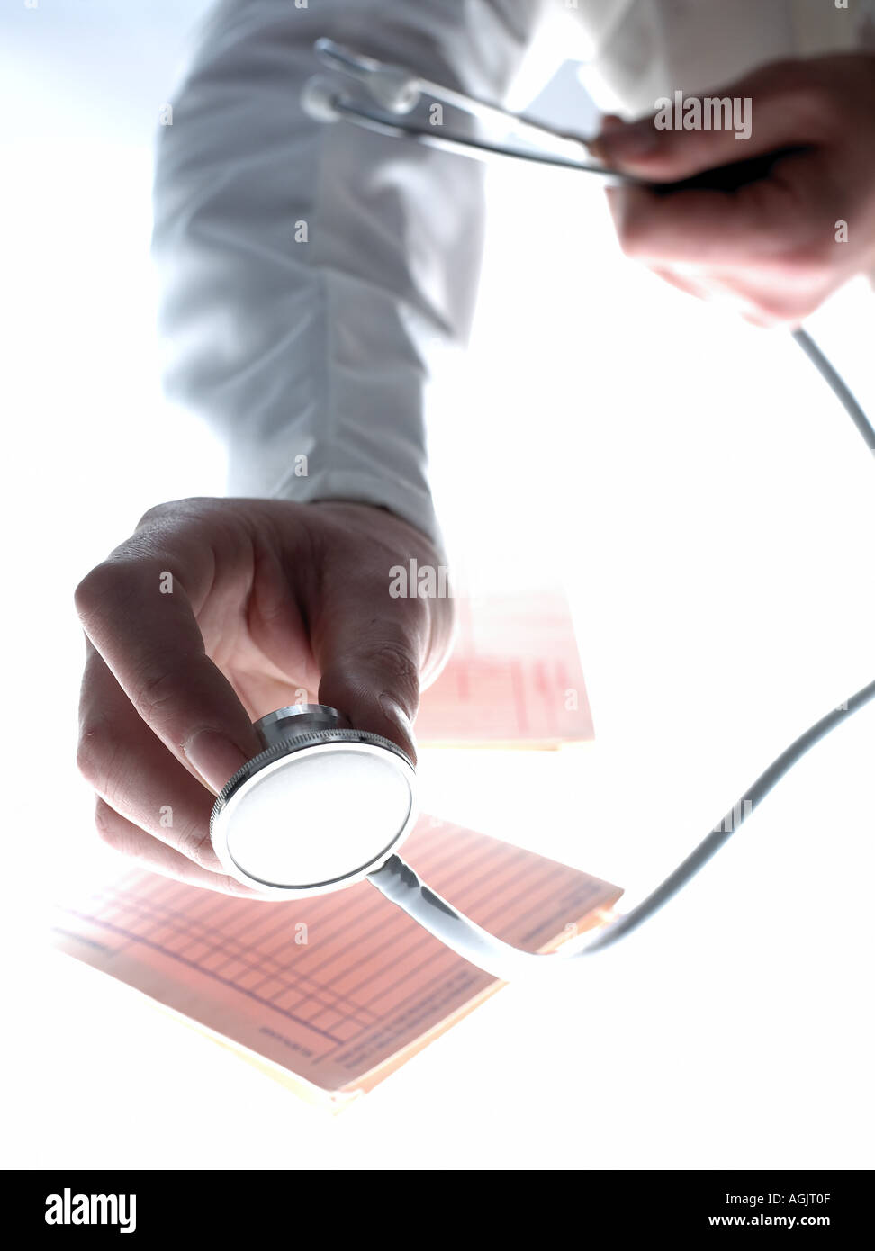 Doctor using stethoscope Stock Photo - Alamy