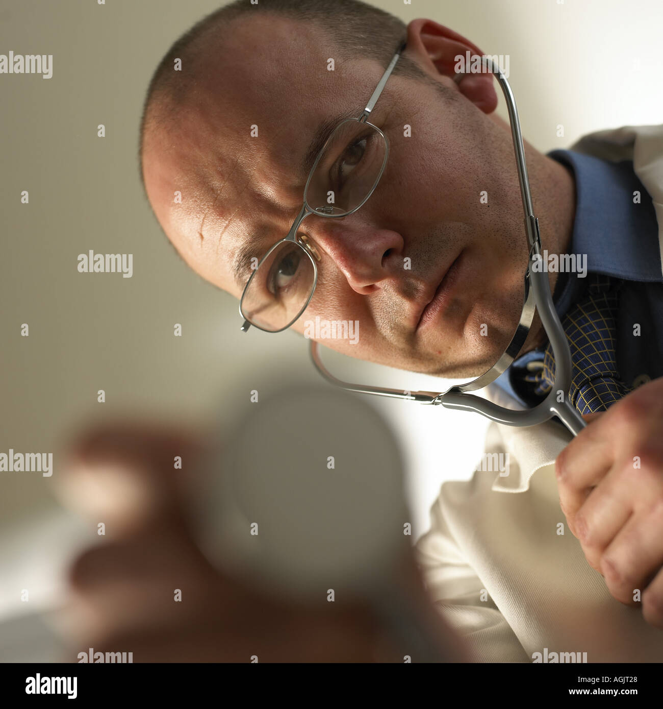 Doctor using stethoscope Stock Photo - Alamy