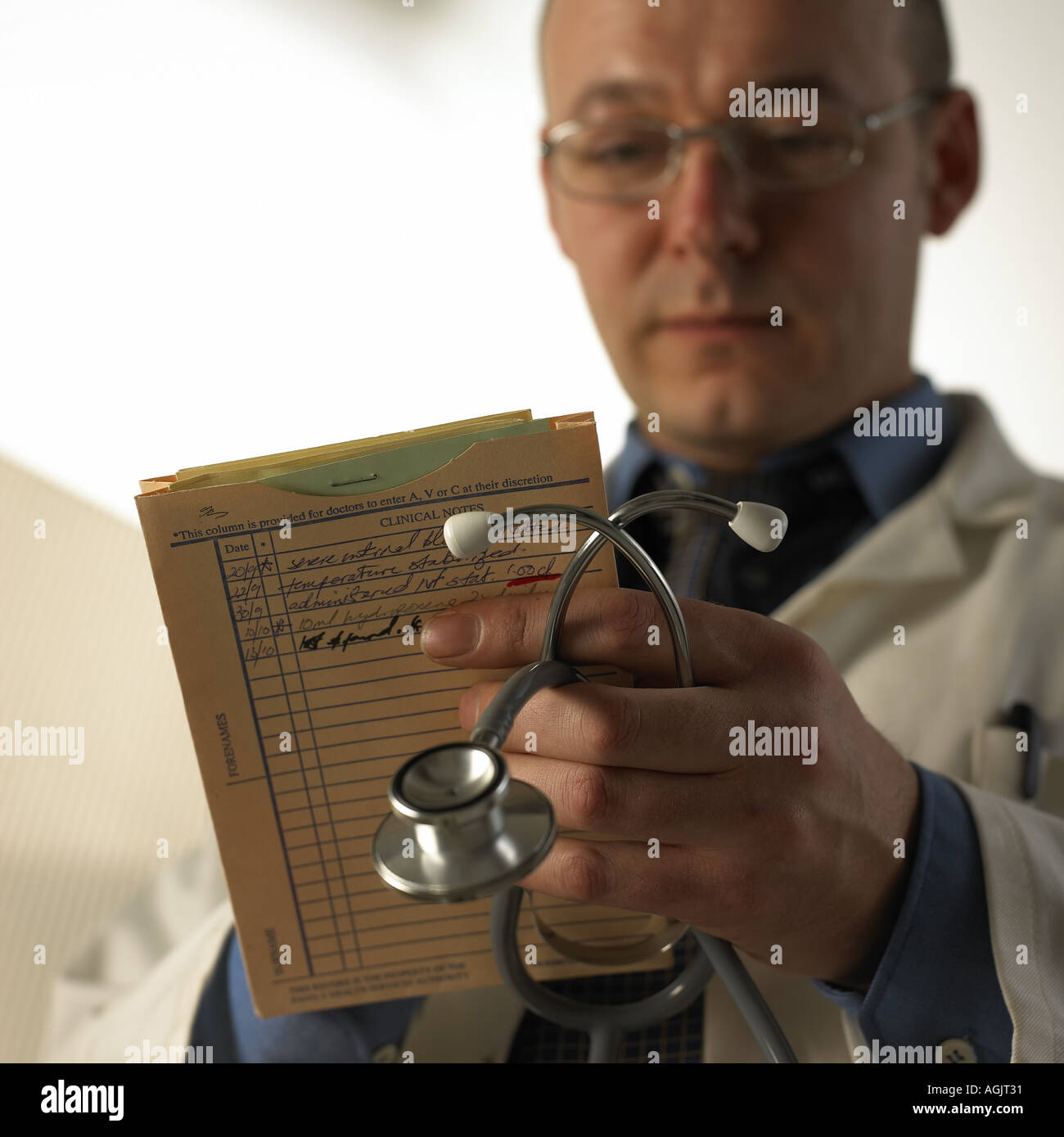 Doctor writing clinical notes Stock Photo - Alamy