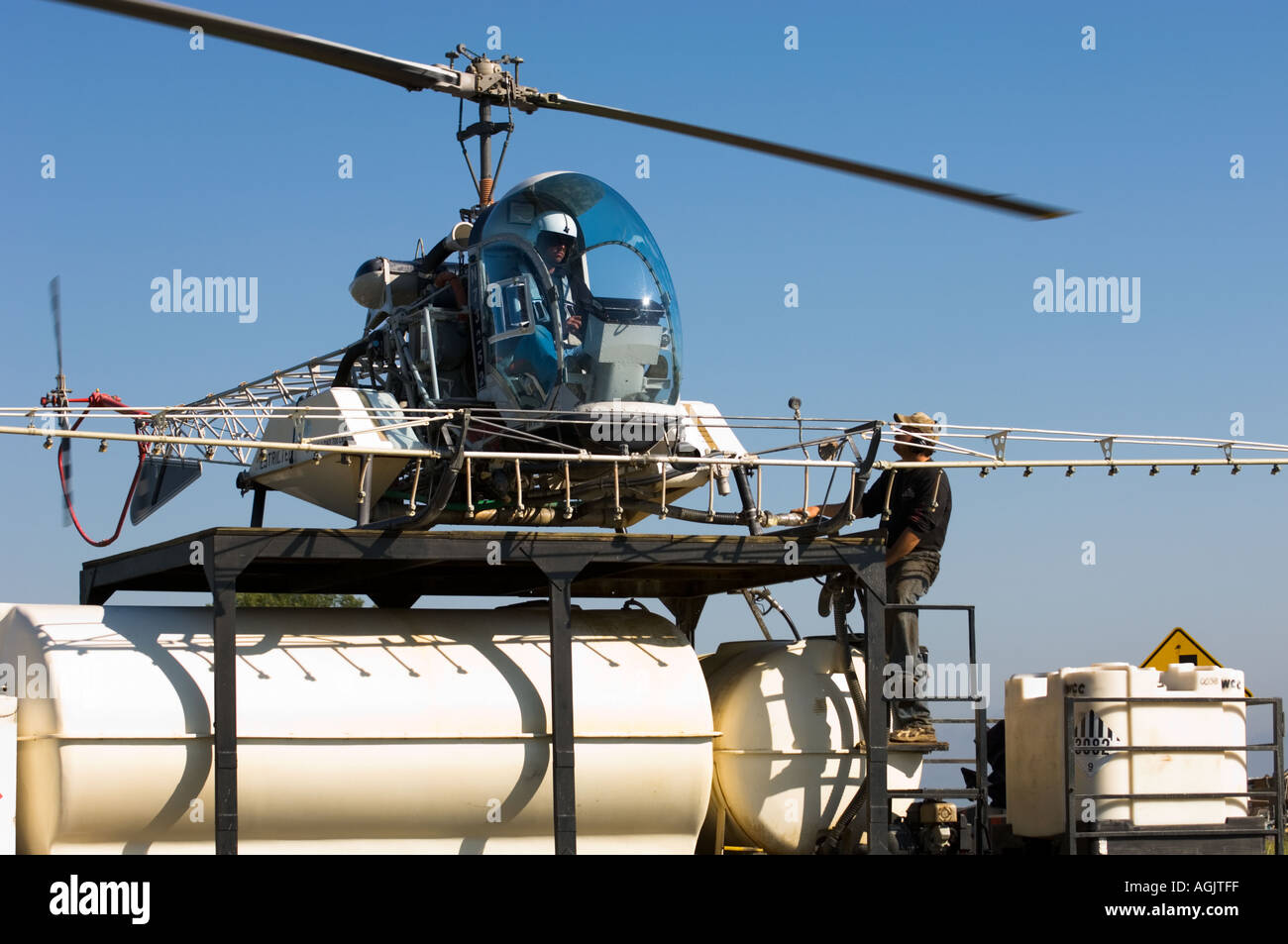 Crop spraying helicopter reloading on truck Stock Photo - Alamy