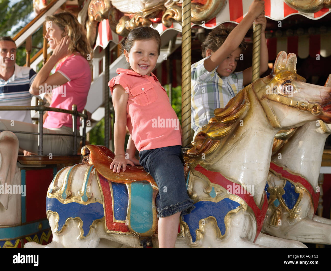 Kids on a carousel Stock Photo - Alamy