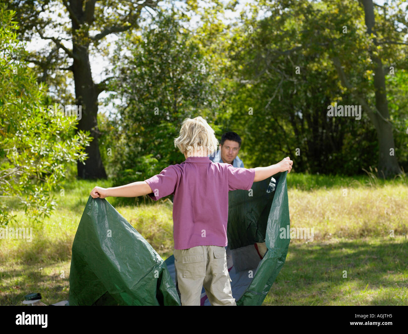 Putting up tent hi-res stock photography and images - Alamy