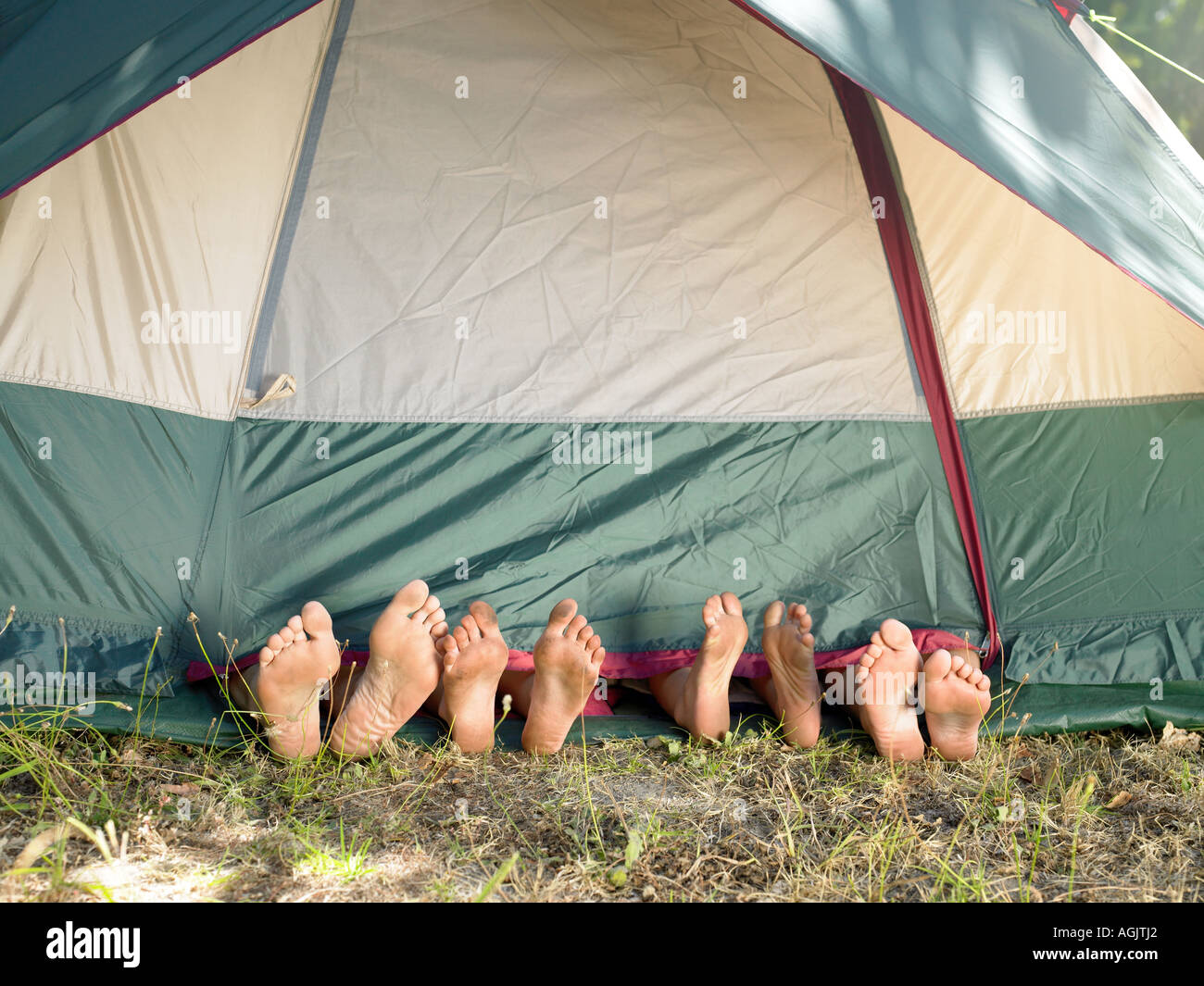 Feet sticking out of a tent Stock Photo - Alamy