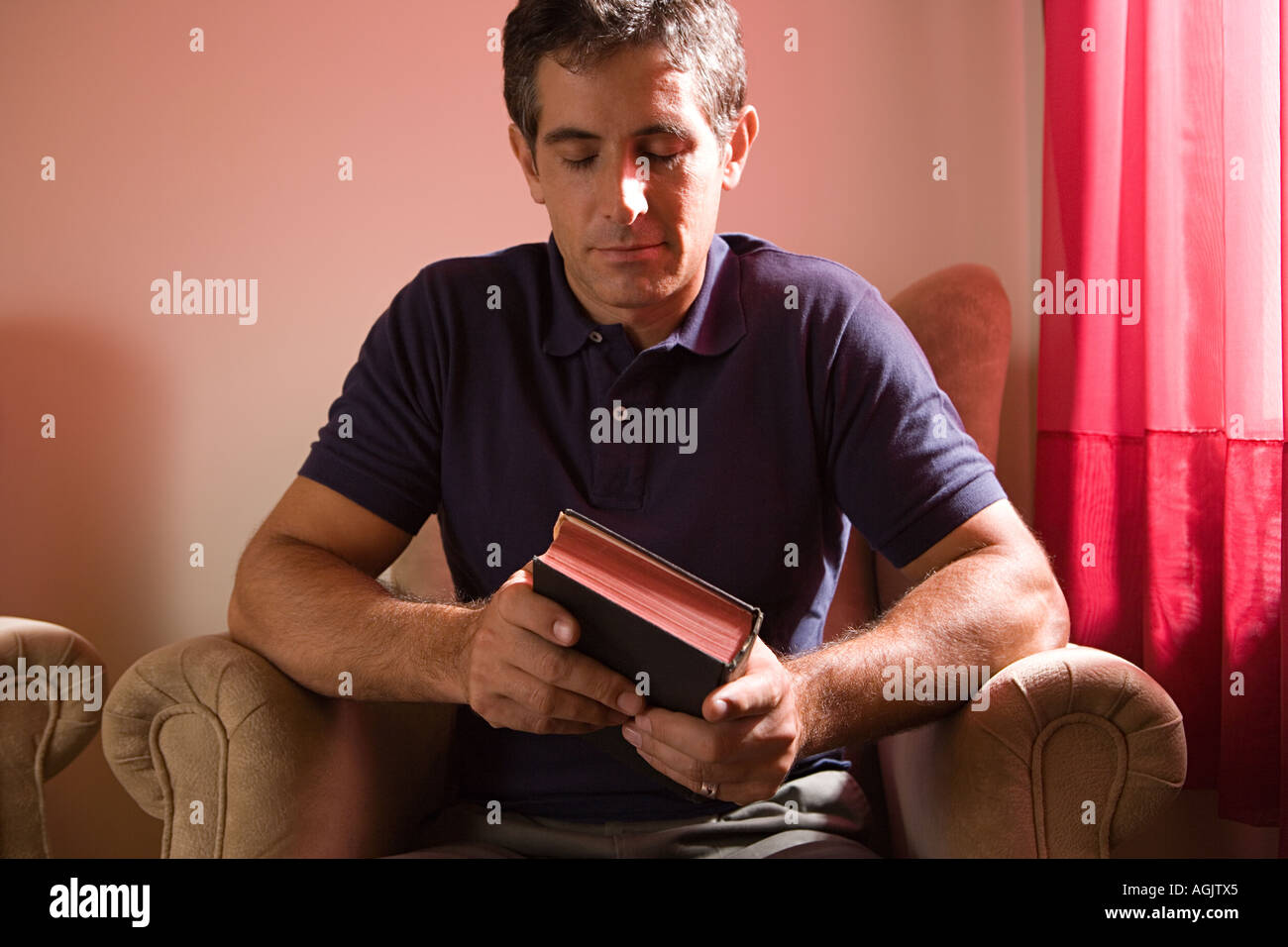 Man holding the bible Stock Photo - Alamy