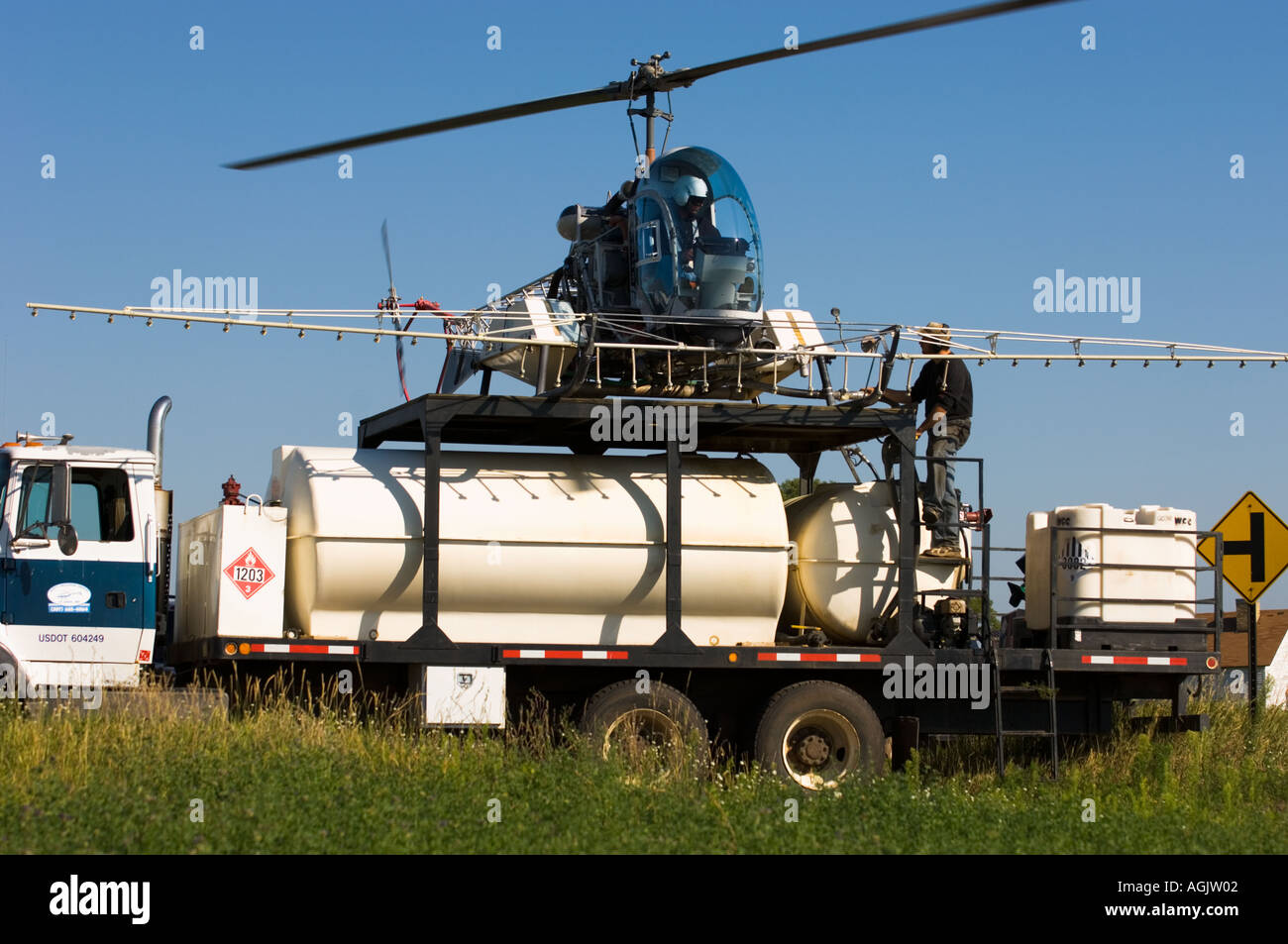 Crop spraying helicopter reloading on truck Stock Photo - Alamy