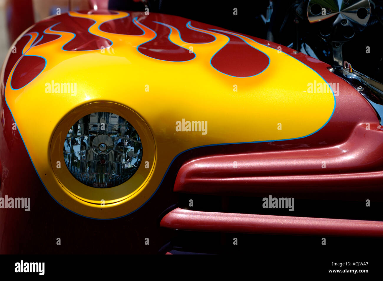 Classic restored car headlight with flames paint job Stock Photo - Alamy