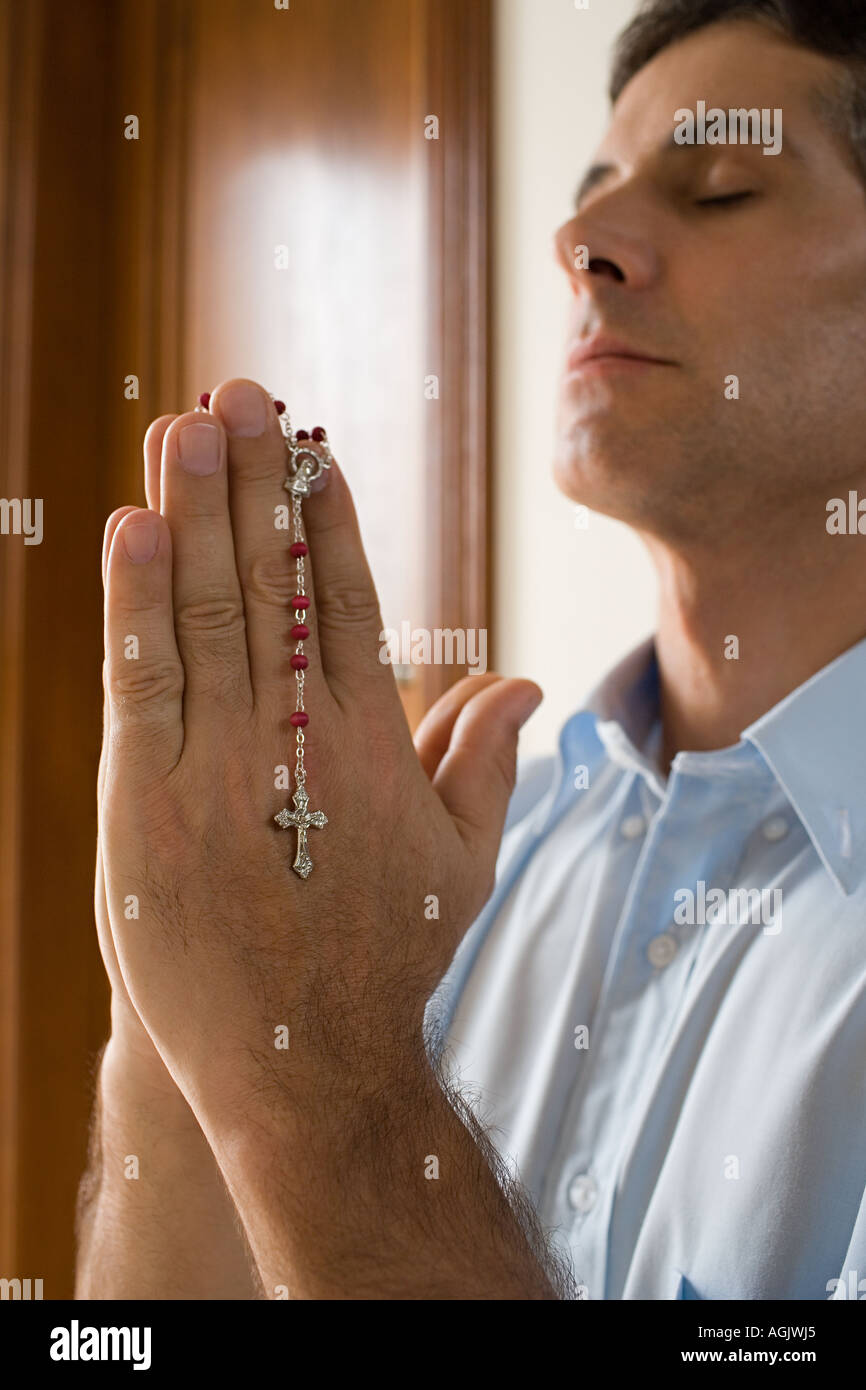 Latin american man praying eyes hi-res stock photography and images - Alamy