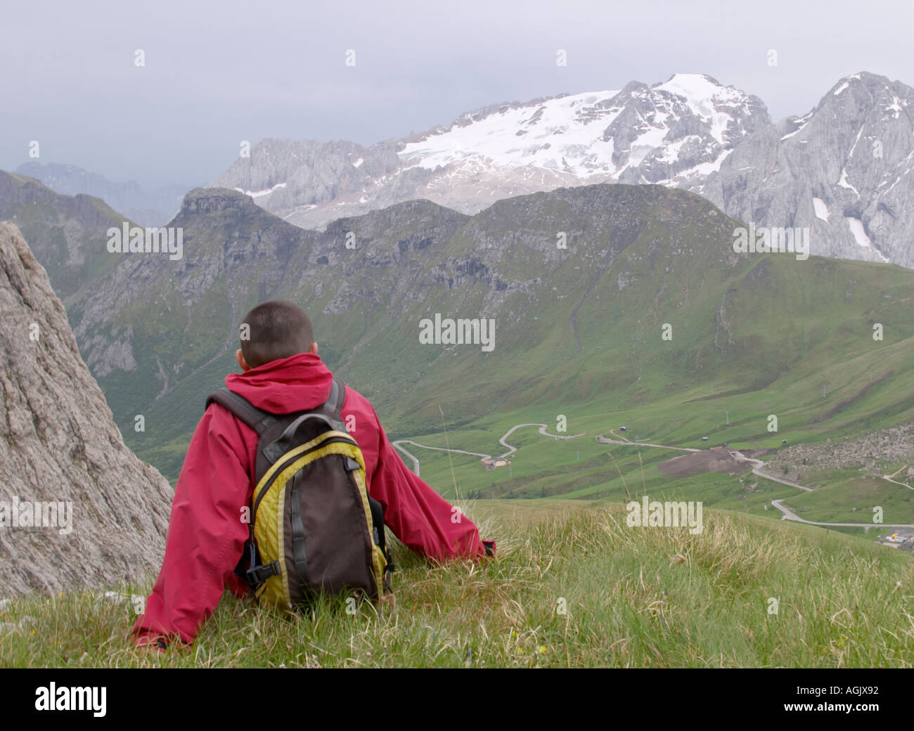 Girl watching the panorama of Marmolada from pass Pordoi in the ...