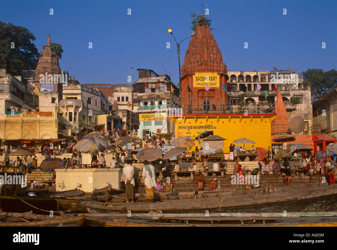Crowds of pilgrims on Dasaswamedh and Prayag Ghats, with row boats ...