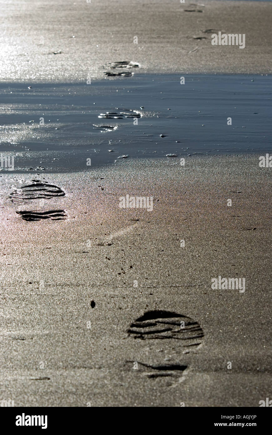 footsteps on the beach Stock Photo - Alamy