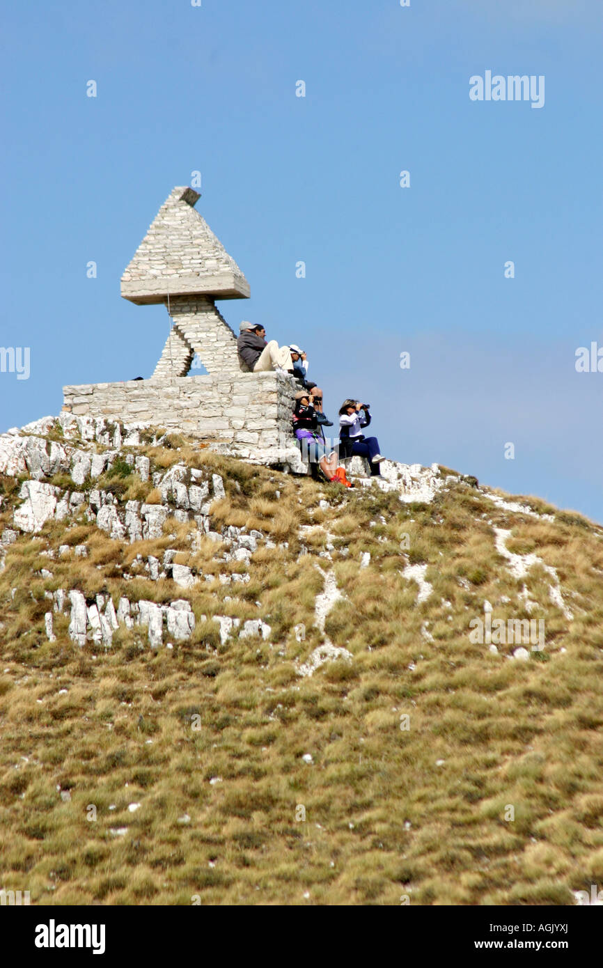 Hikers resting on a mountain ridge in the Sibillini Mountain Range ,Le ...