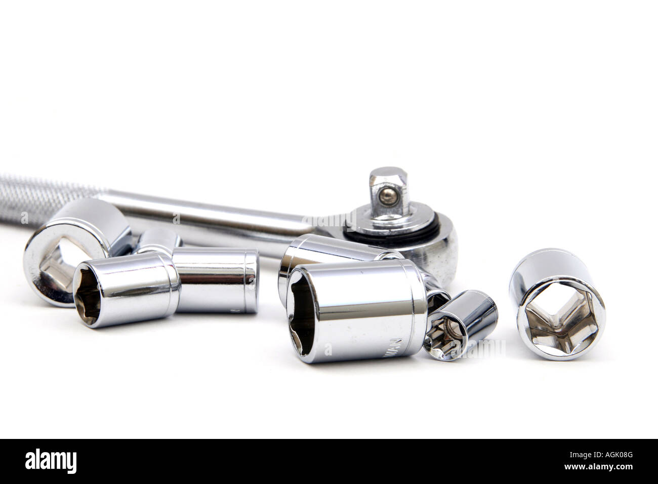 A chrome ratchet with a bunch of sockets Stock Photo - Alamy