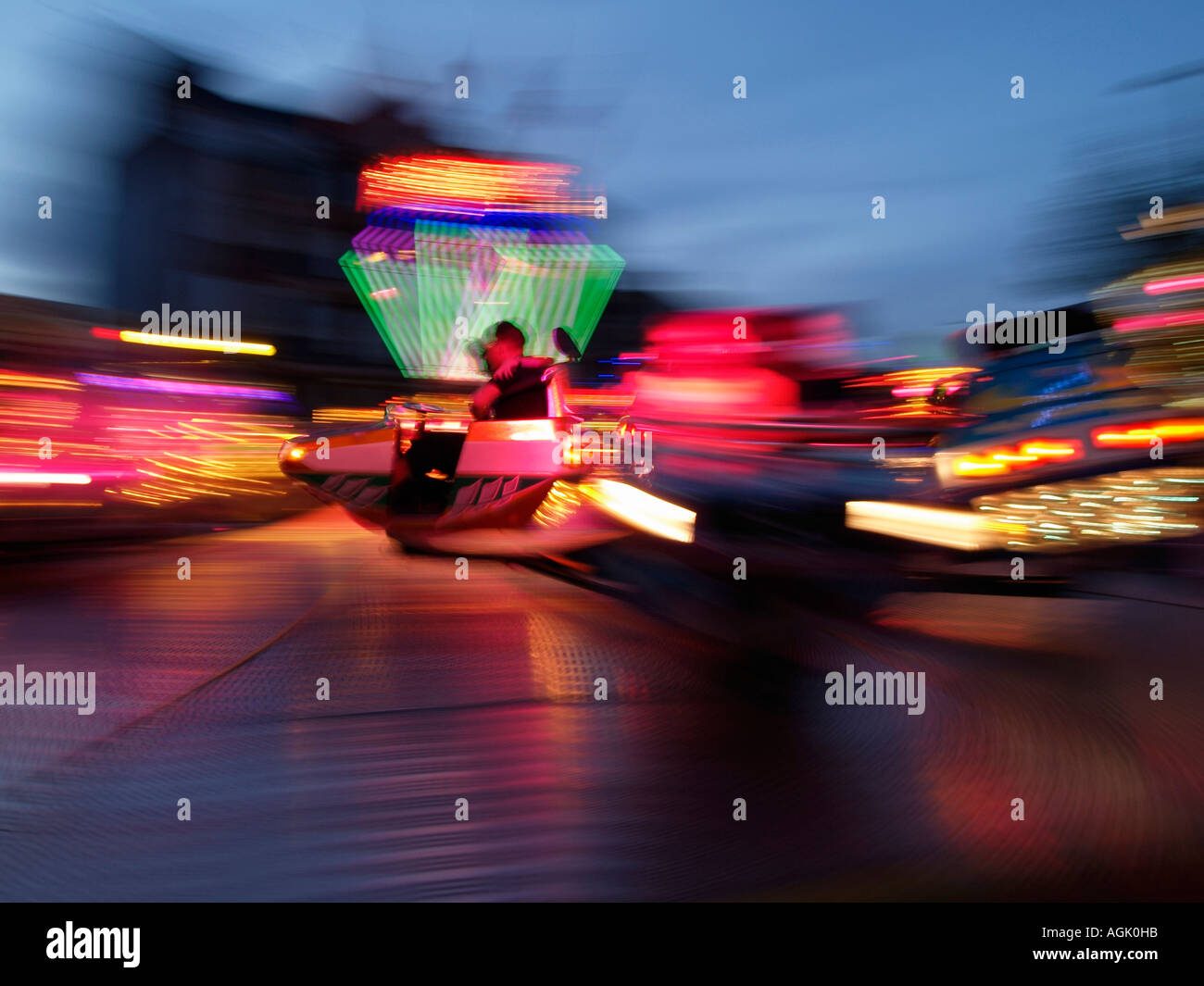 People in fast spinning ride on the yearly fun fair fairground in ...