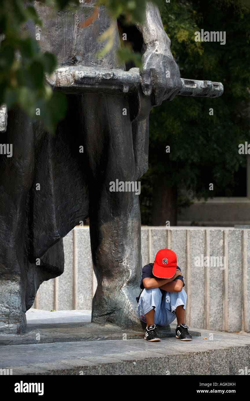 Boy sits on the monument of the Slovak Uprising. Namesti SNP ...