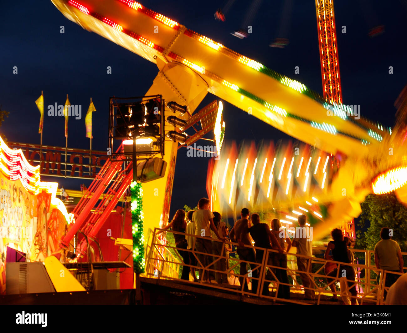 People waiting for their turn on the yearly fun fair fairground in ...
