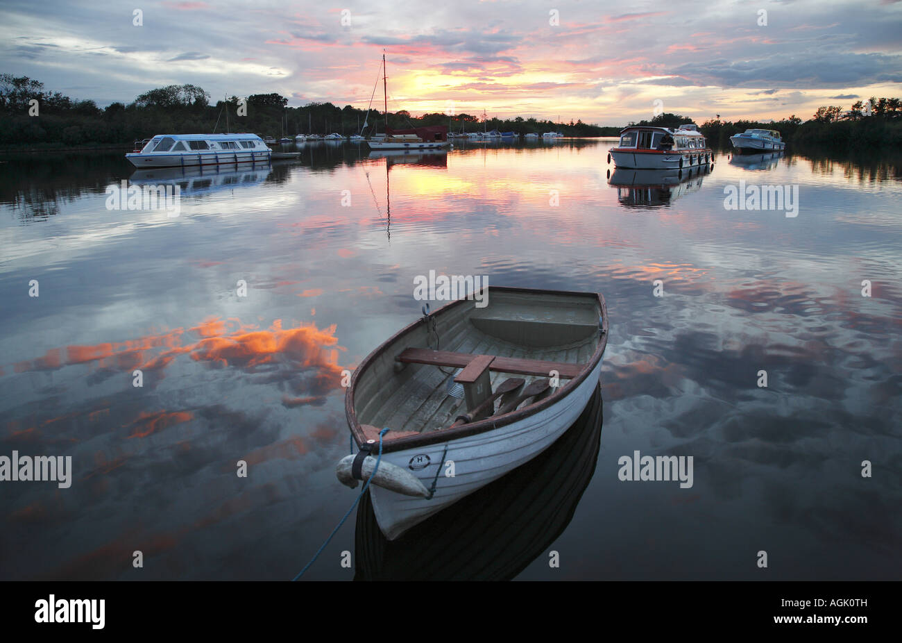 Dinghy and Hire cruisers at sunset on Malthouse Broad Ranworth The ...