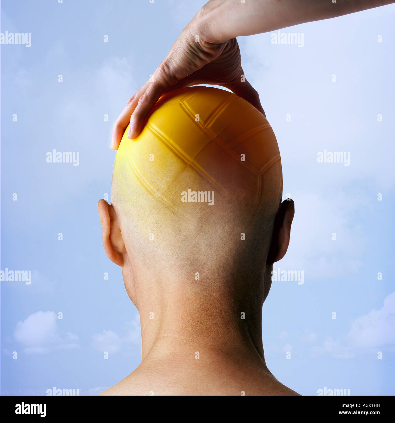 Hand holding man s head as the ball Stock Photo - Alamy