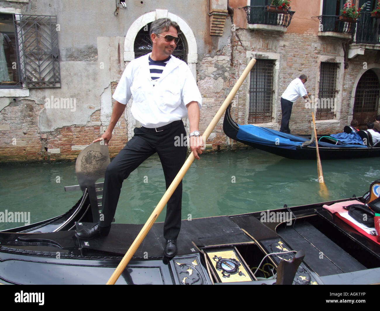 gondoliers in venice Stock Photo - Alamy