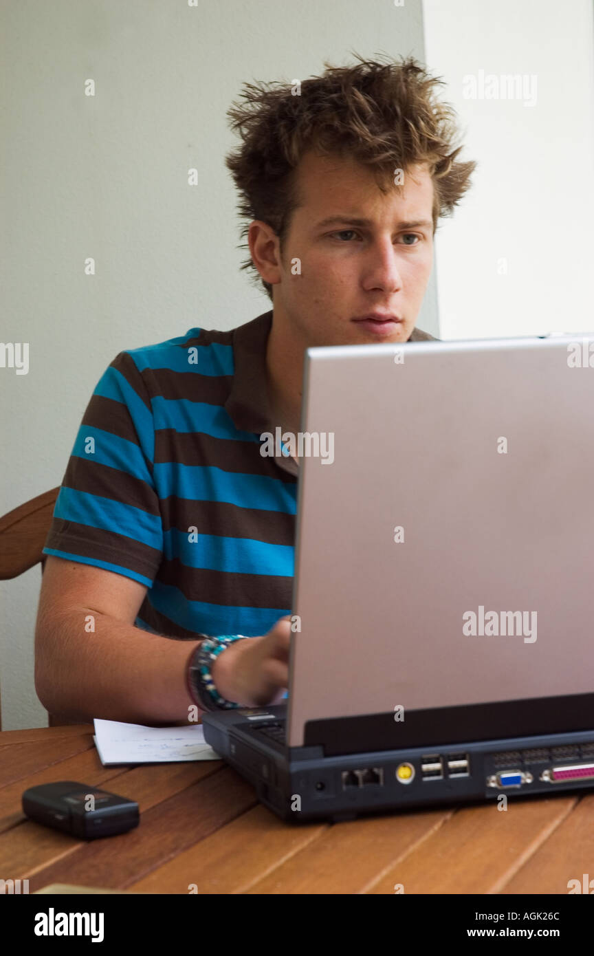 Student use laptop garden vertical hi-res stock photography and images ...