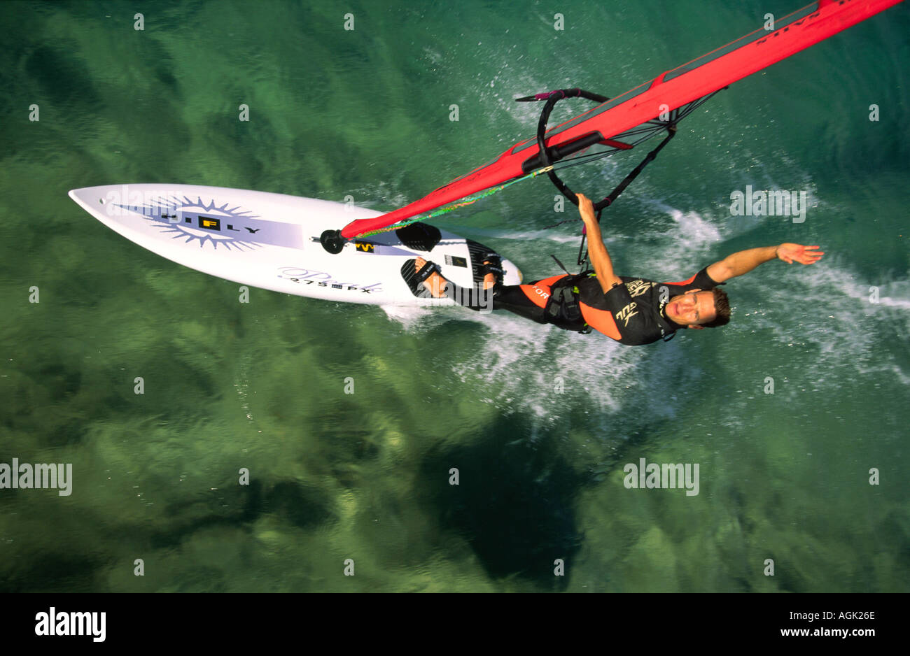 aerial shot of windsurfer sailing one handed waving on the Red Sea ...