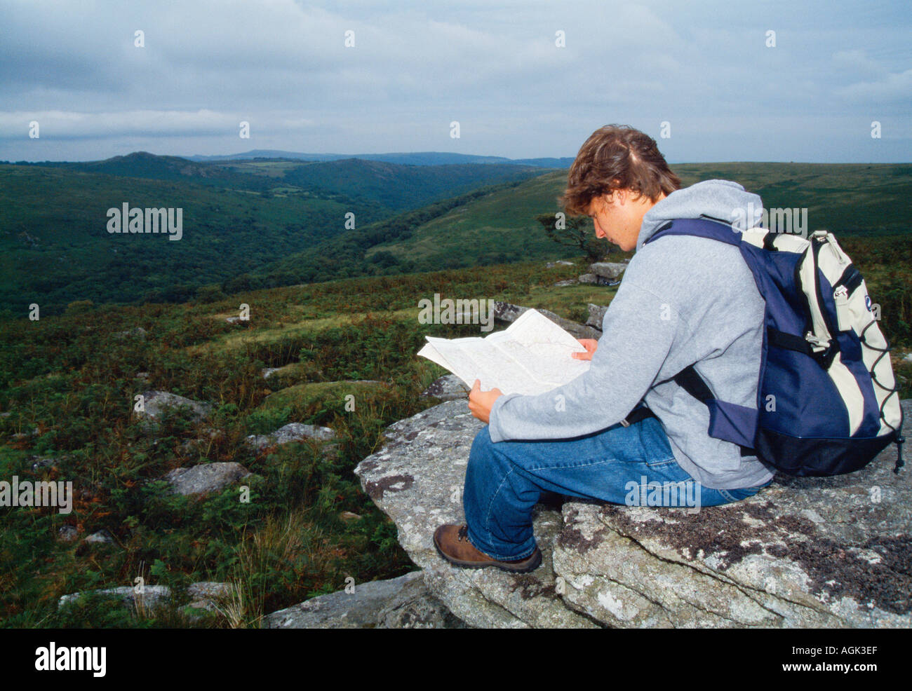 Hiker looking map in hi-res stock photography and images - Alamy