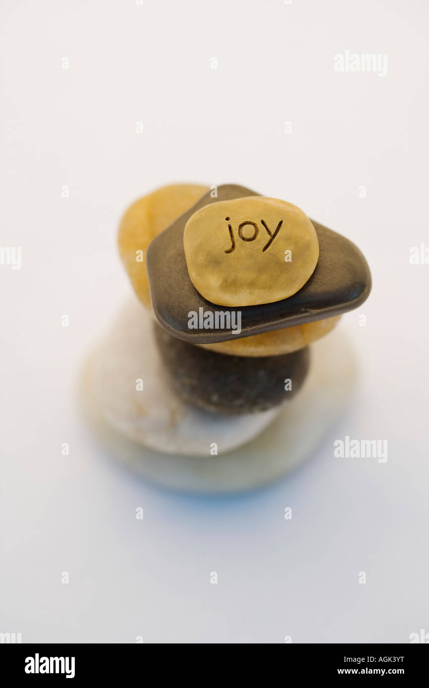 Stack of stones representing joy Stock Photo - Alamy