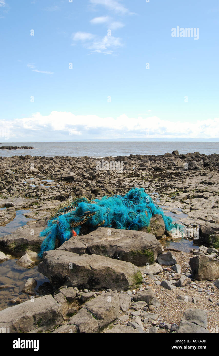 discarded plastic fishing net snagged on rocks number 2517 Stock Photo ...