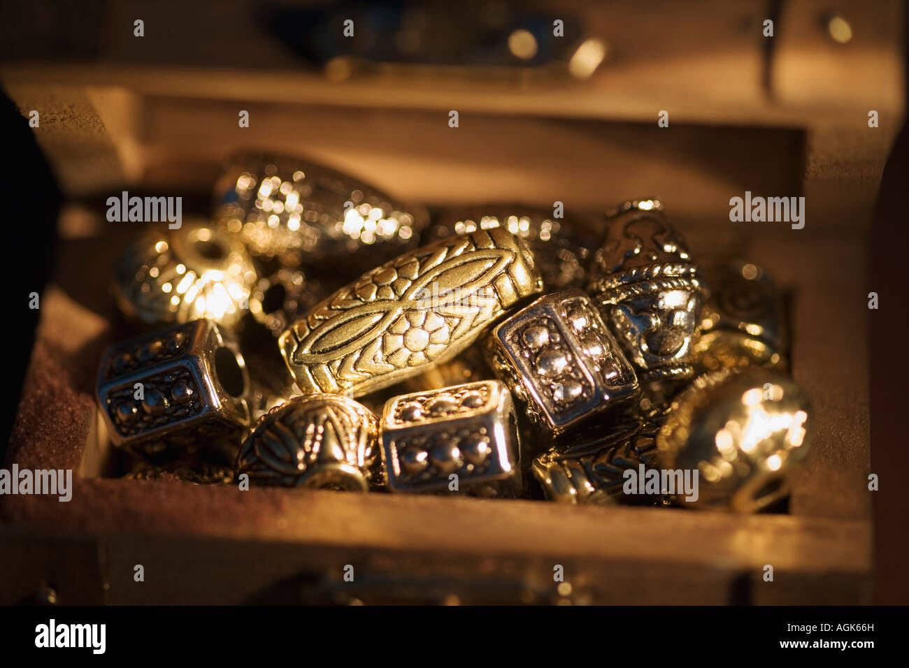 Golden beads in box Stock Photo - Alamy