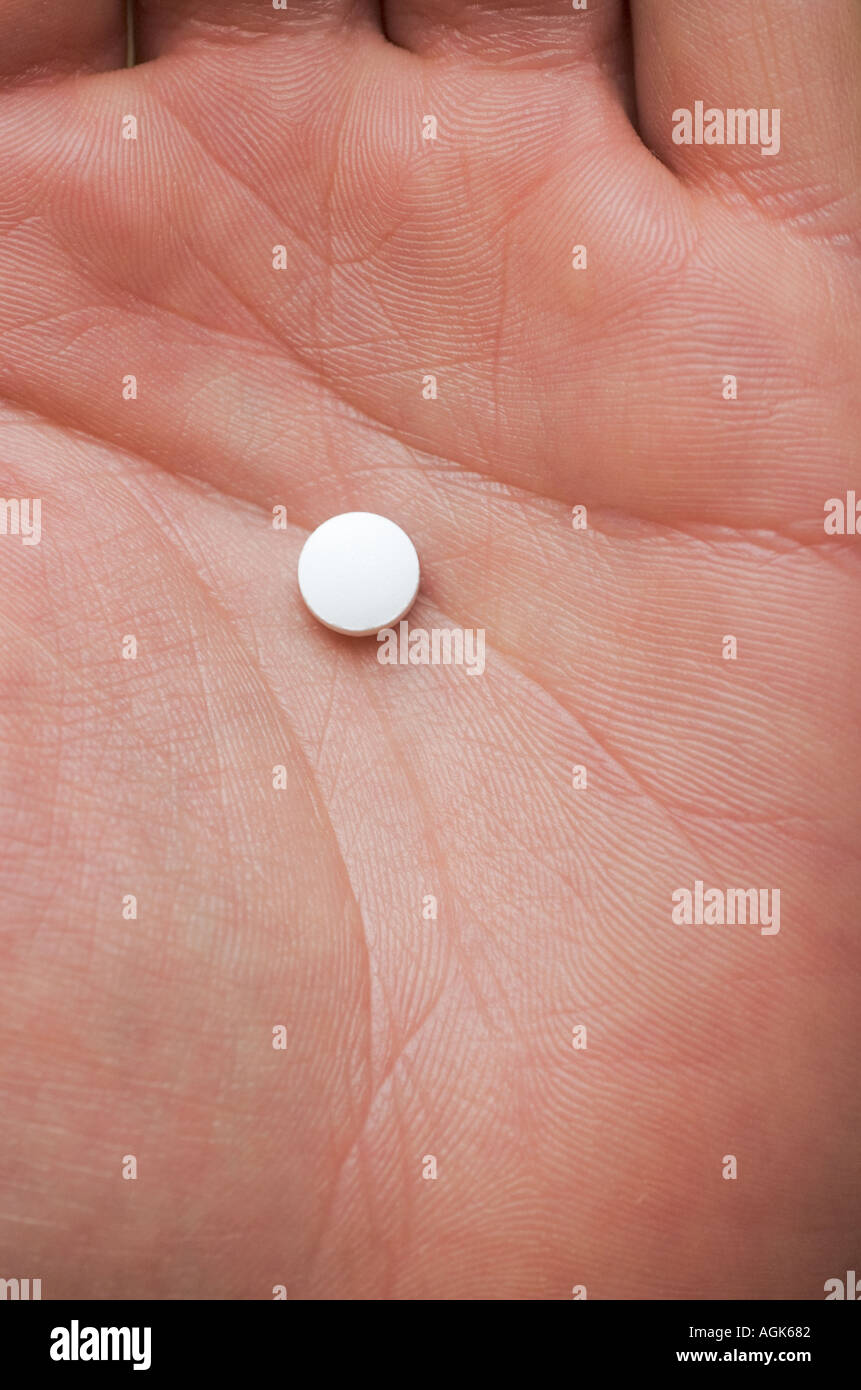 Medical Pill in the Palm of a hand Stock Photo - Alamy