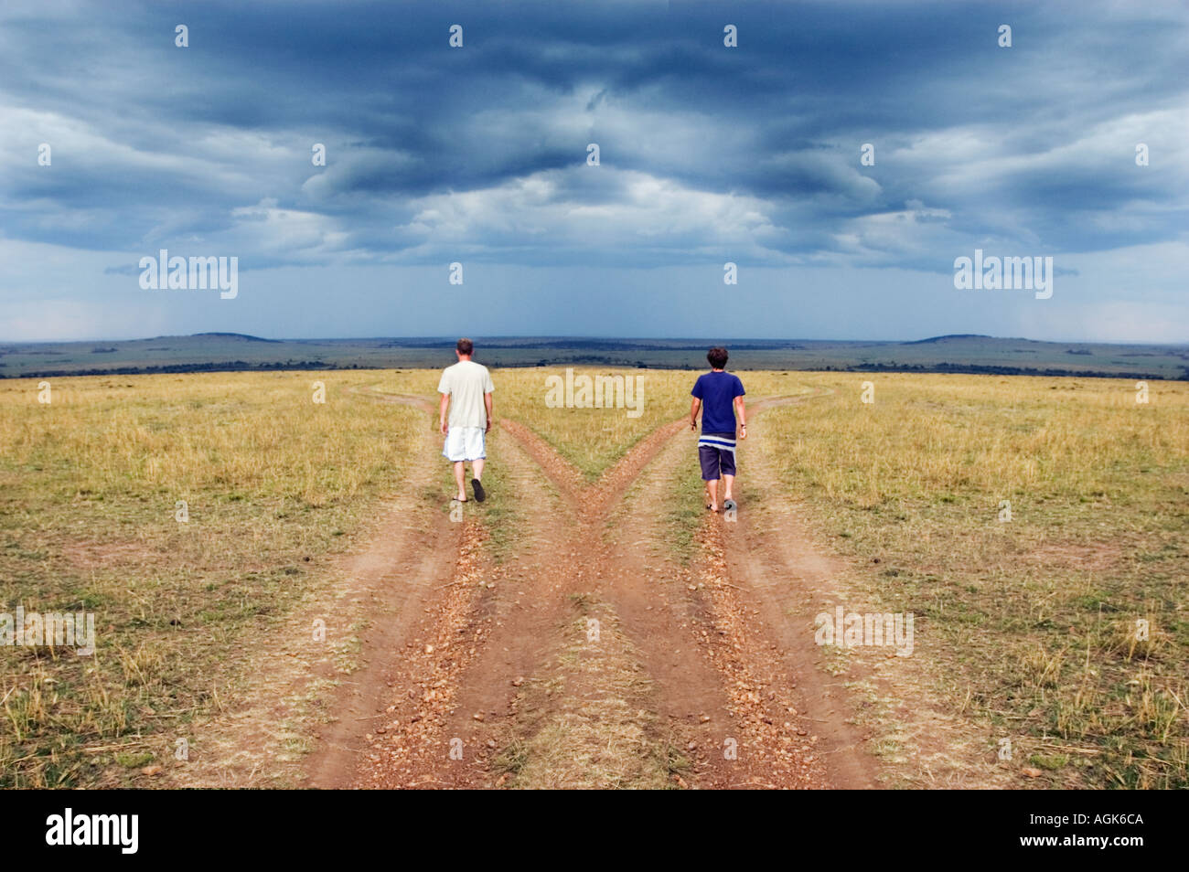 Two young men walking down different paths Stock Photo: 2635465 - Alamy