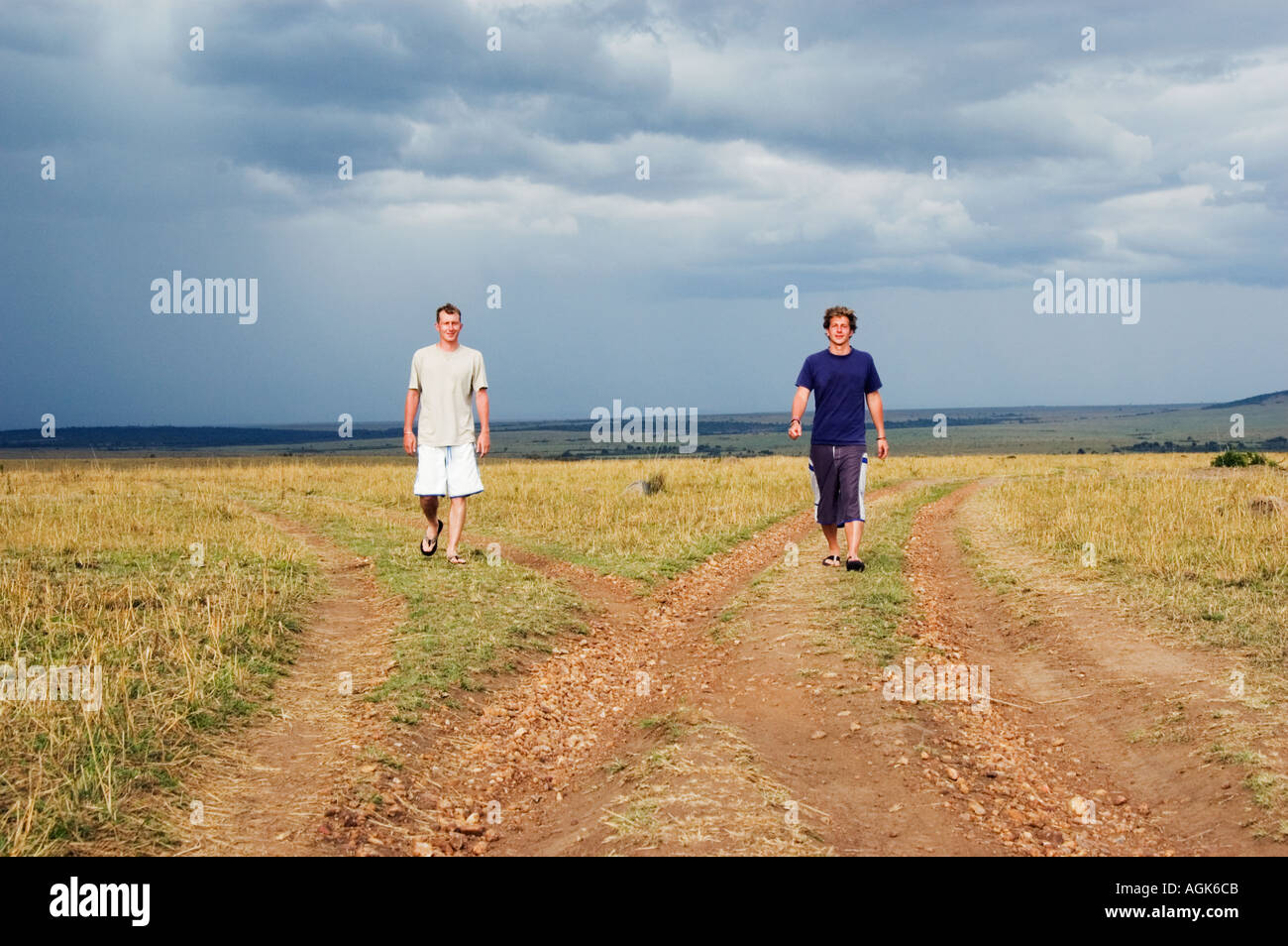 Two young men on different paths coming together Stock Photo - Alamy