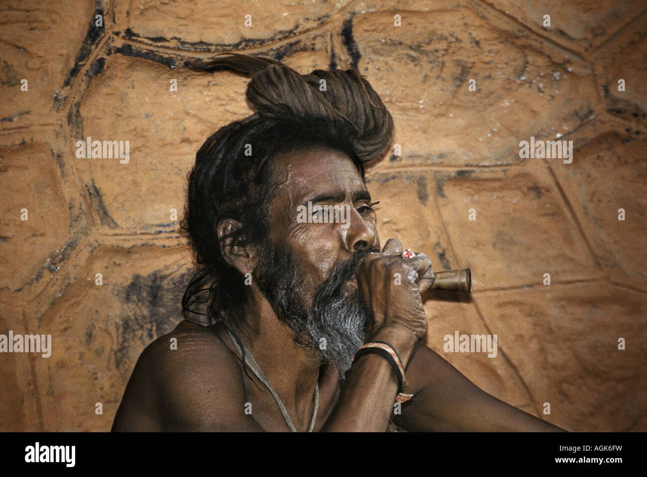 An Indian Sadhu smokes his Chillum Stock Photo - Alamy