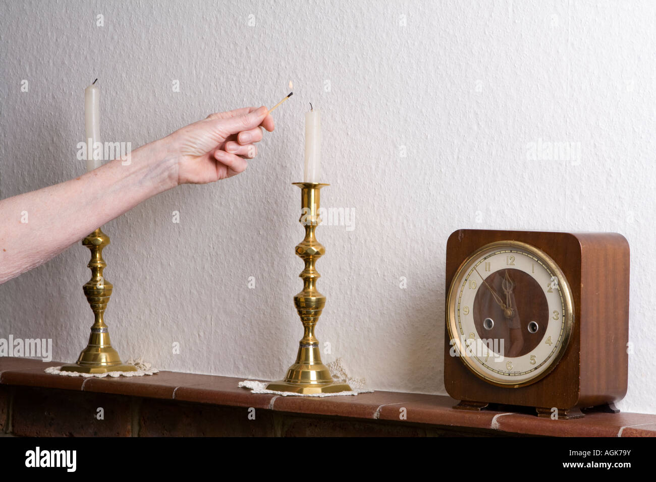 Lighting a candle Stock Photo - Alamy