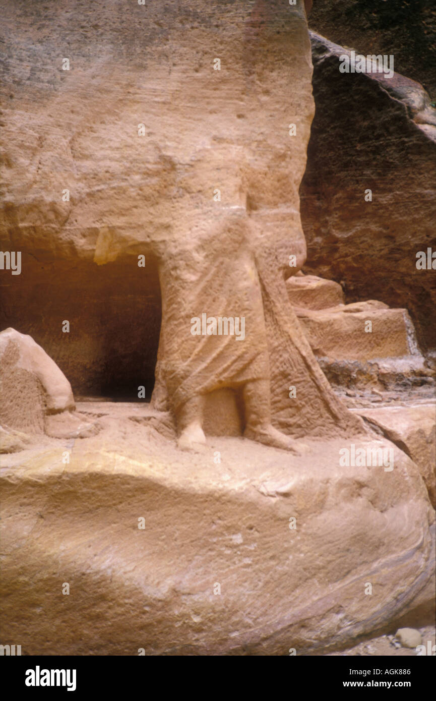 Eroded half human figure carved in rock, Petra Stock Photo - Alamy