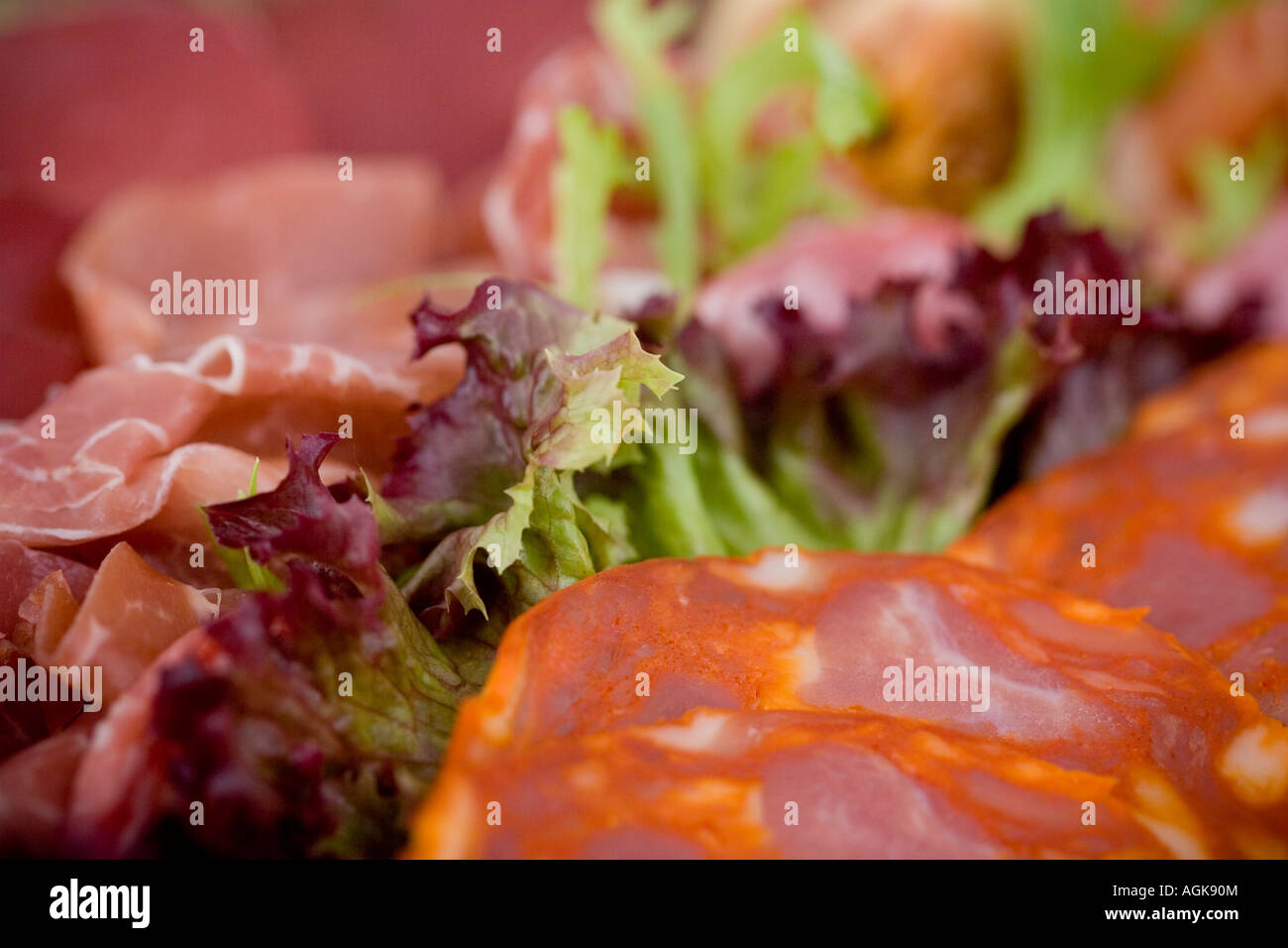 Chorizo and ham with salad Stock Photo - Alamy