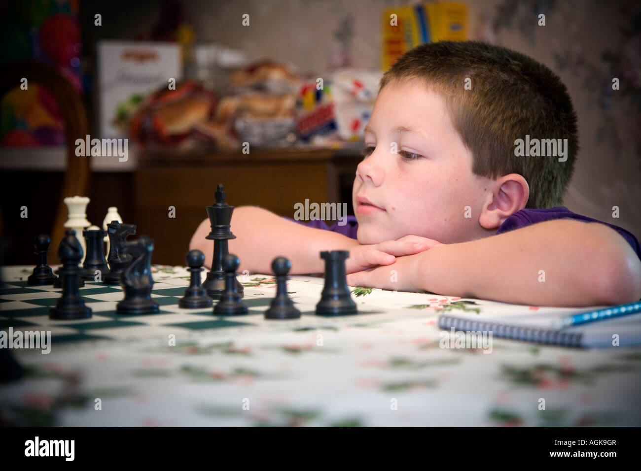 Young Boy Playing Chess Stock Photo - Alamy