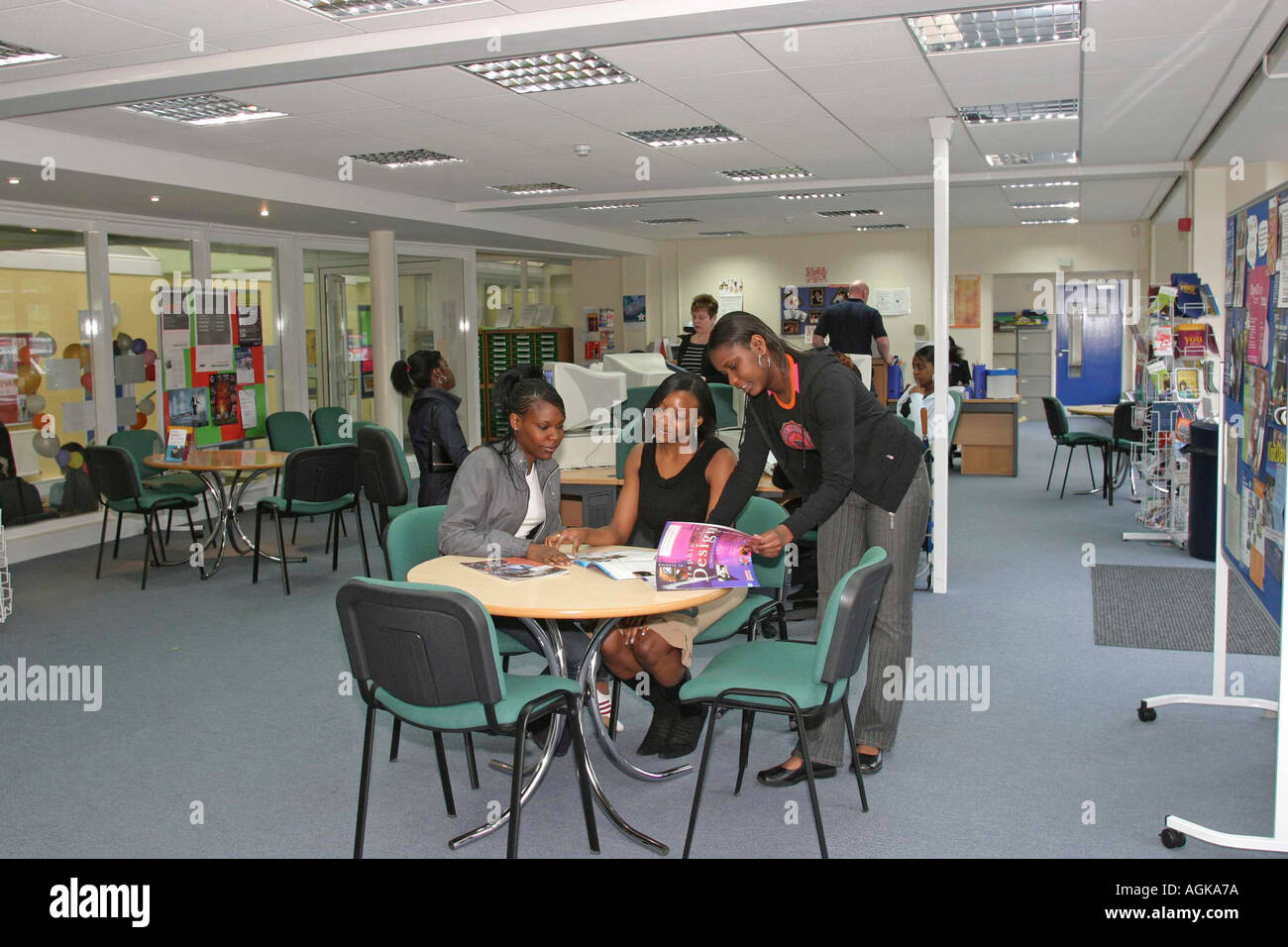 Female Students and tutor at 6th form college library south London GB ...