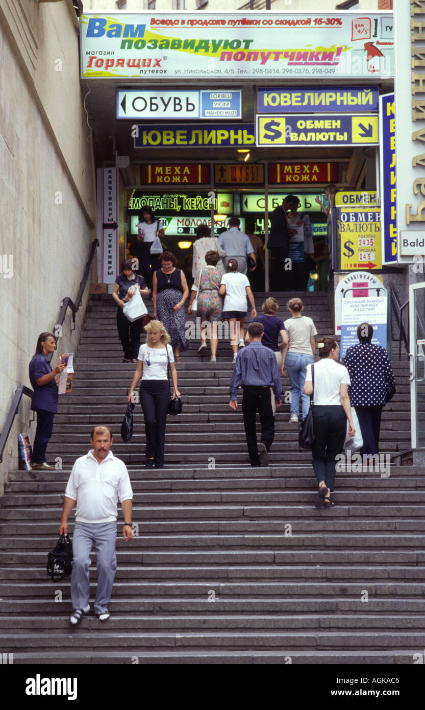 Shoppers in Moscow pass a plethora of shop signs Stock Photo - Alamy