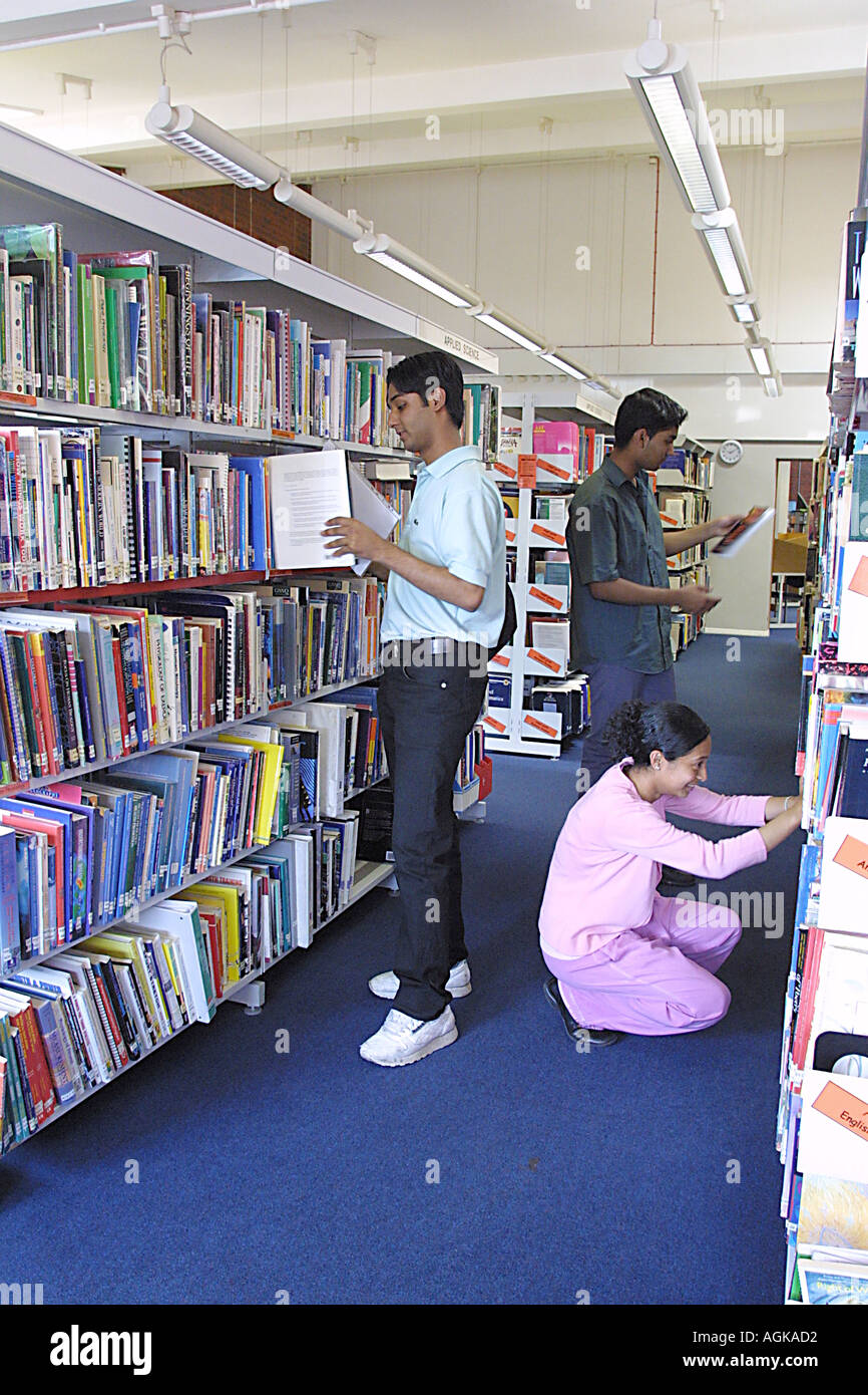 Male female ethnic sixth form college students in college library hi ...