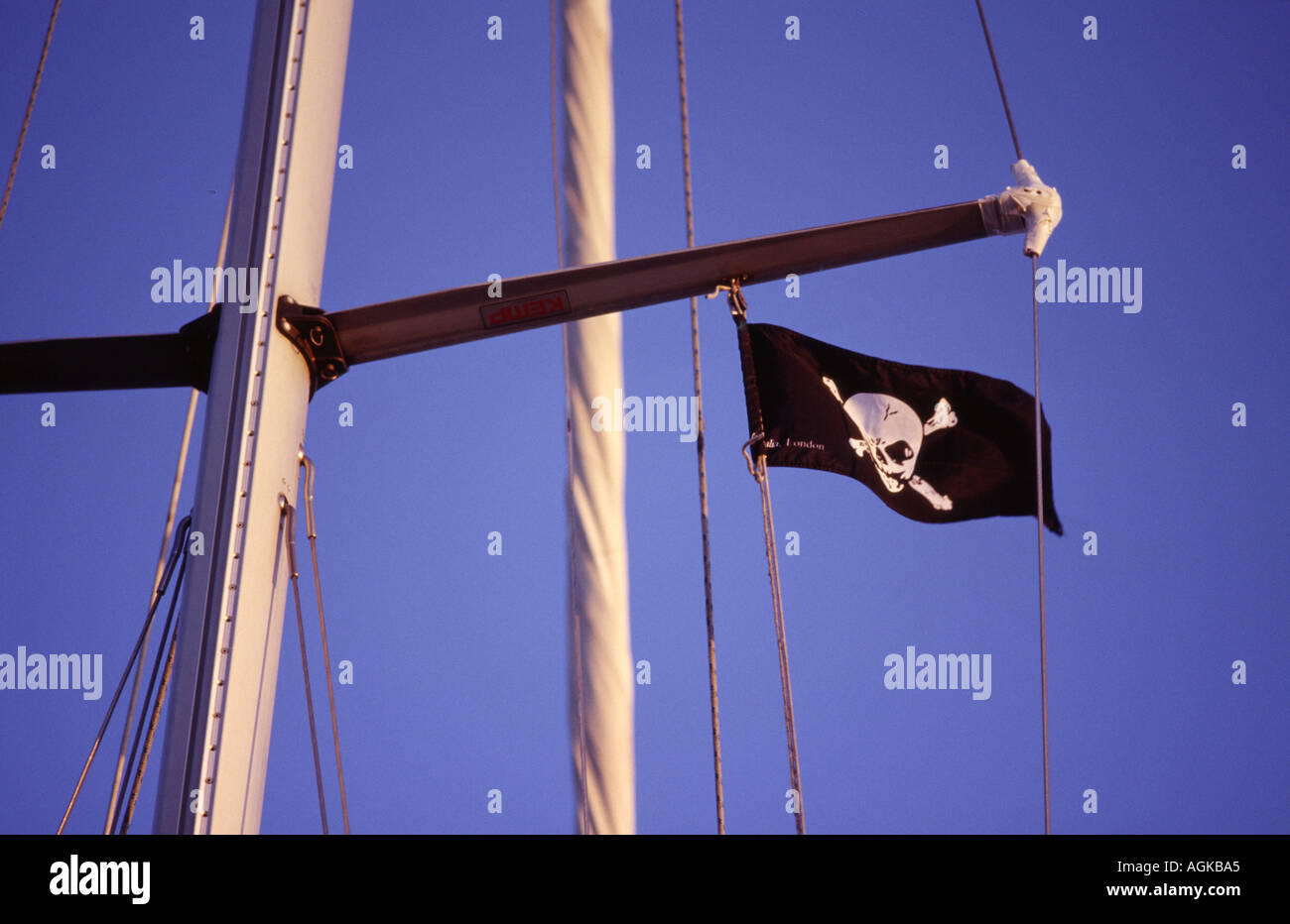 The Jolly Roger flag flying at the spreaders of a yacht Stock Photo - Alamy