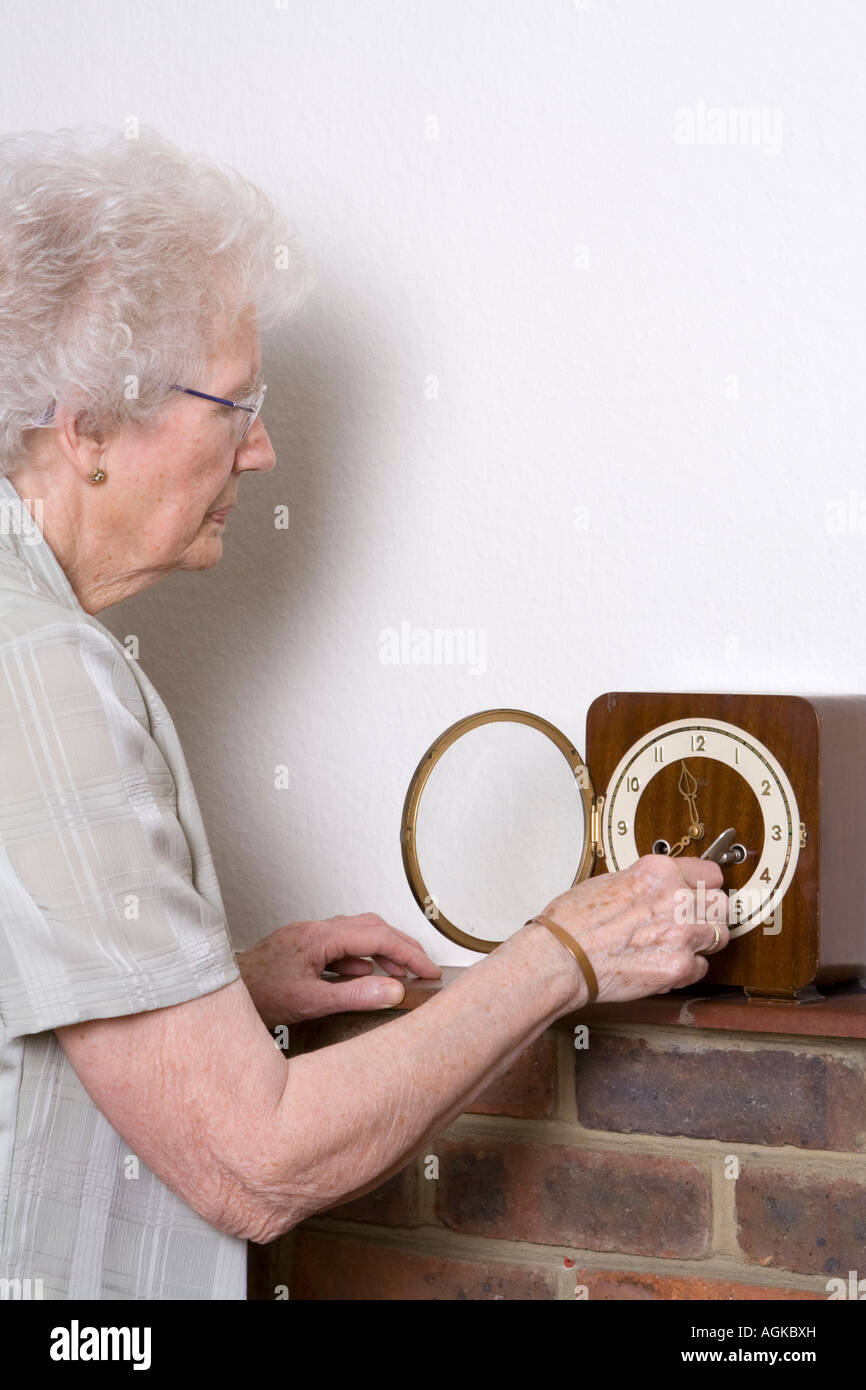 Winding a clock hi-res stock photography and images - Alamy