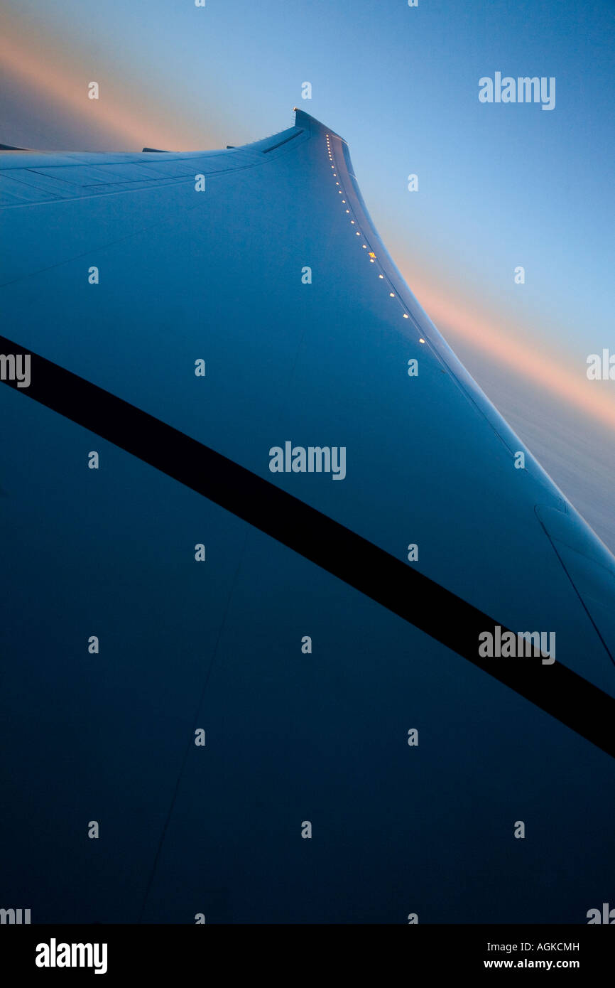 graphic shot of airplane wing taken at sunrise Stock Photo - Alamy