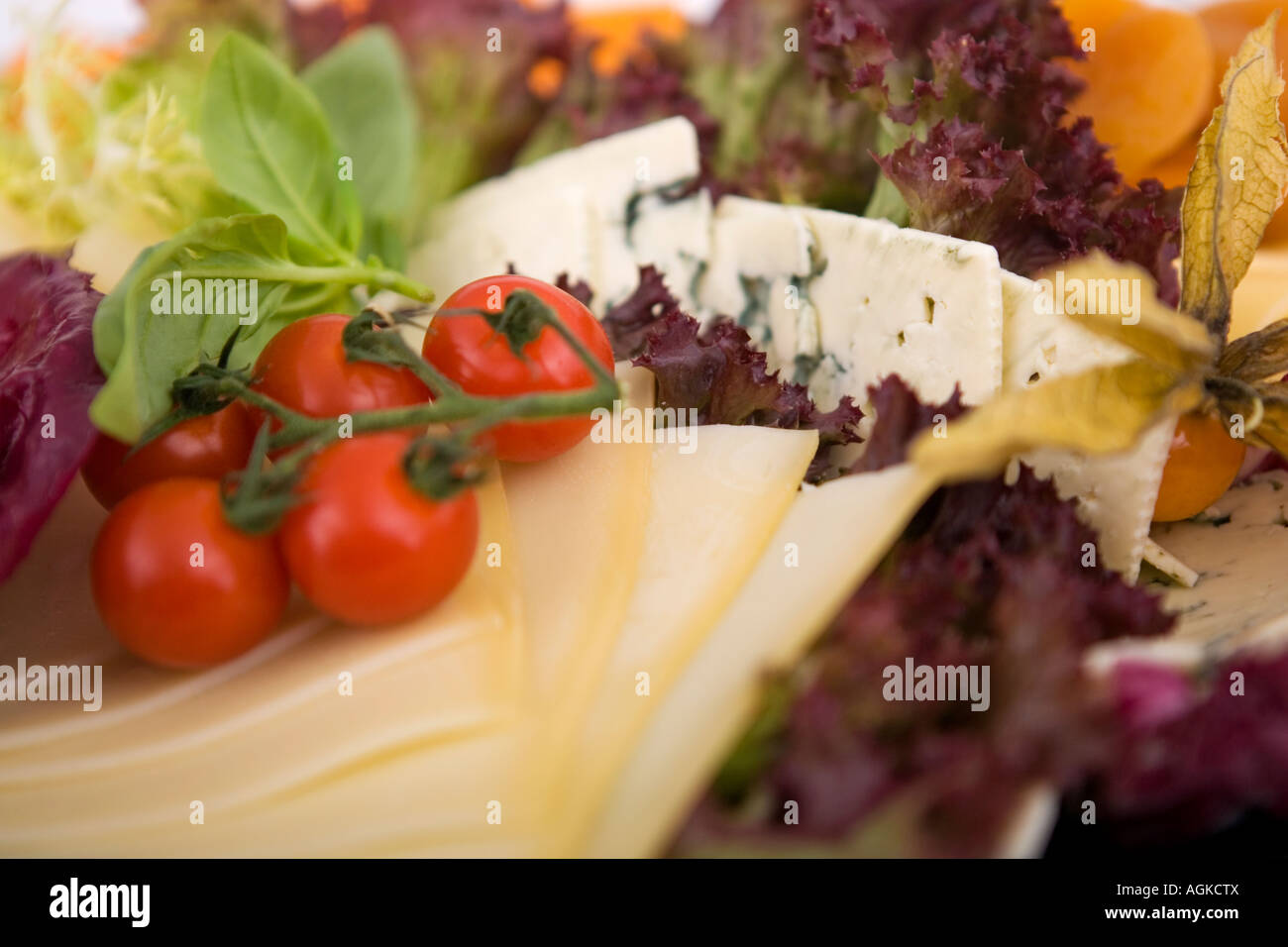Selection of cheeses and salad on tray Stock Photo - Alamy