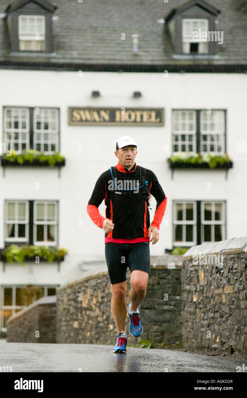 A runner breaking the world record by running ten marathons in ten days ...