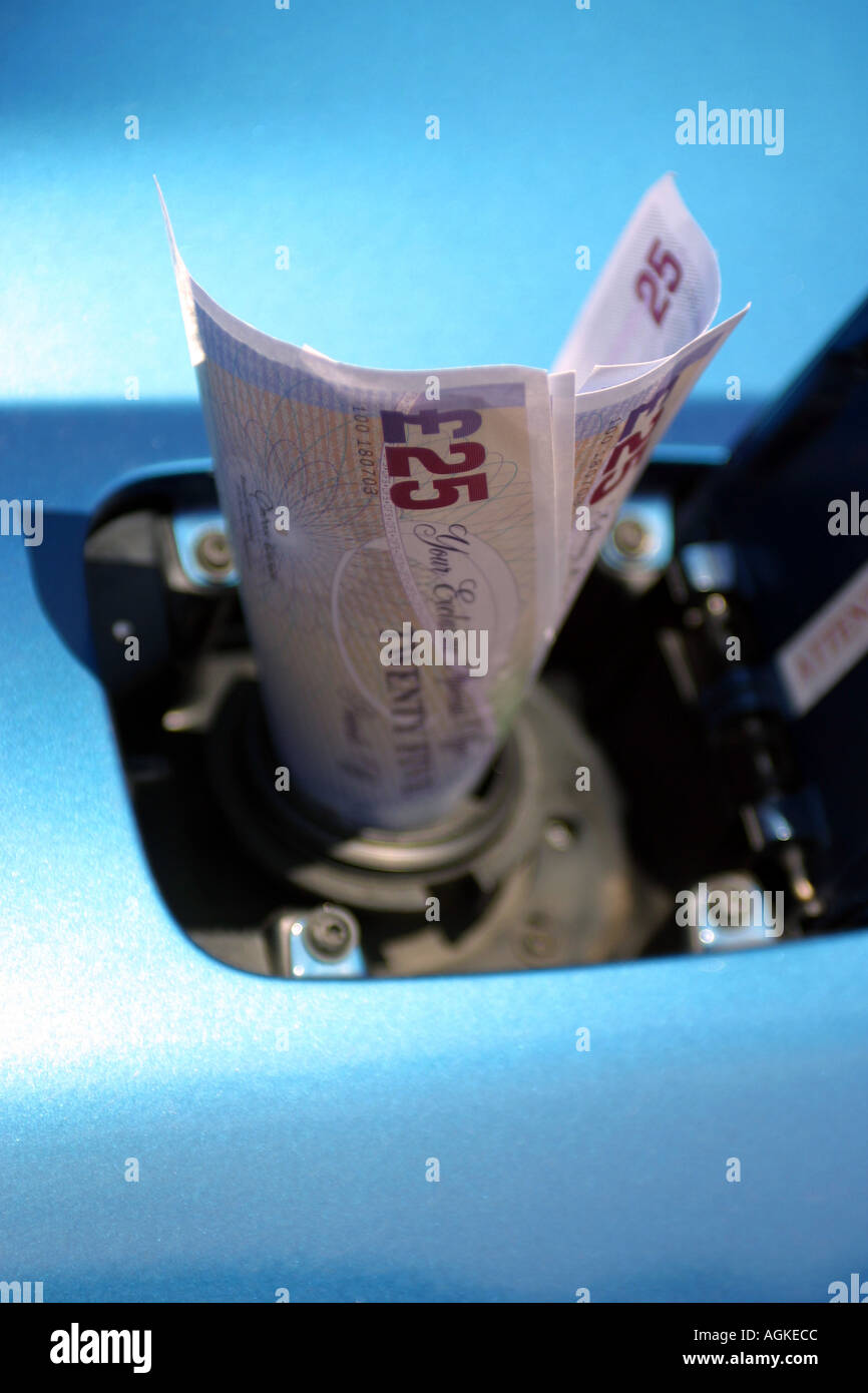 Fake Pound Notes placed in a Fuel Filler cap Stock Photo - Alamy