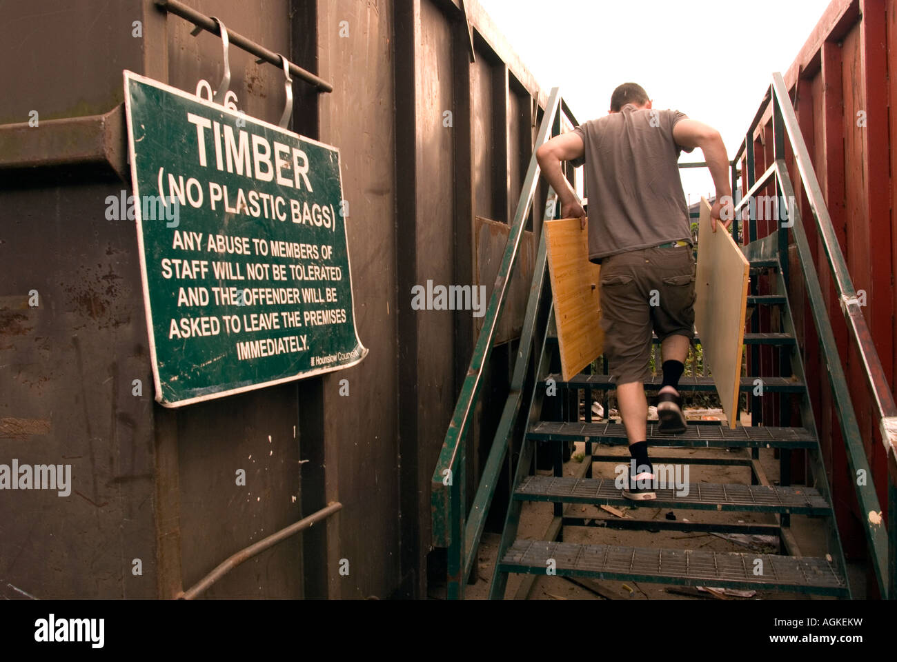 Man disposing of timber waste at Space Waye Recycling and Reuse Centre ...