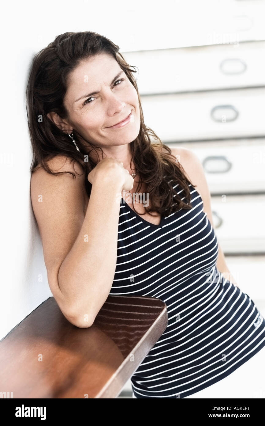Portrait of a mid adult woman smirking Stock Photo - Alamy